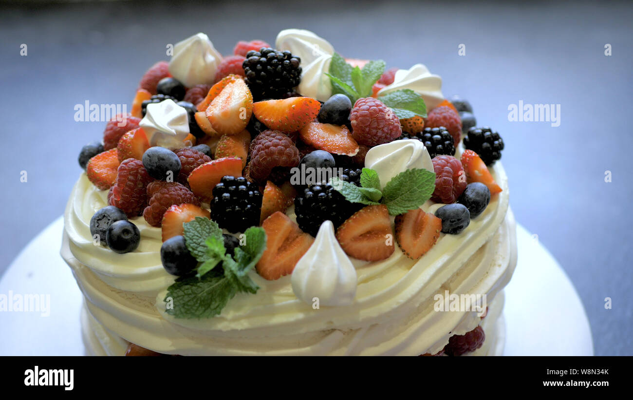 Dessert Anna Pavlova on a black background Stock Photo - Alamy