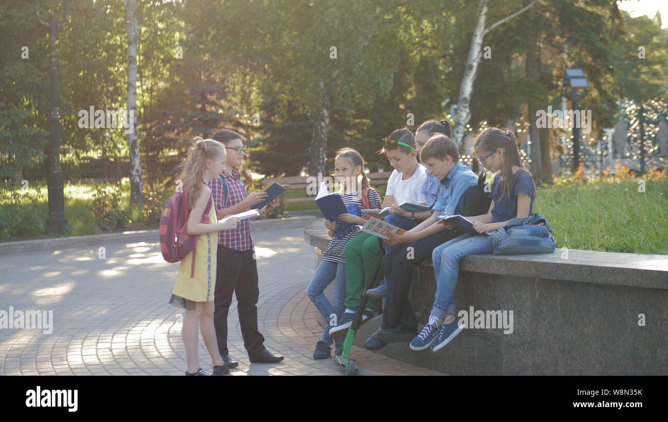 Cute kids study with books and notebooks Stock Photo - Alamy