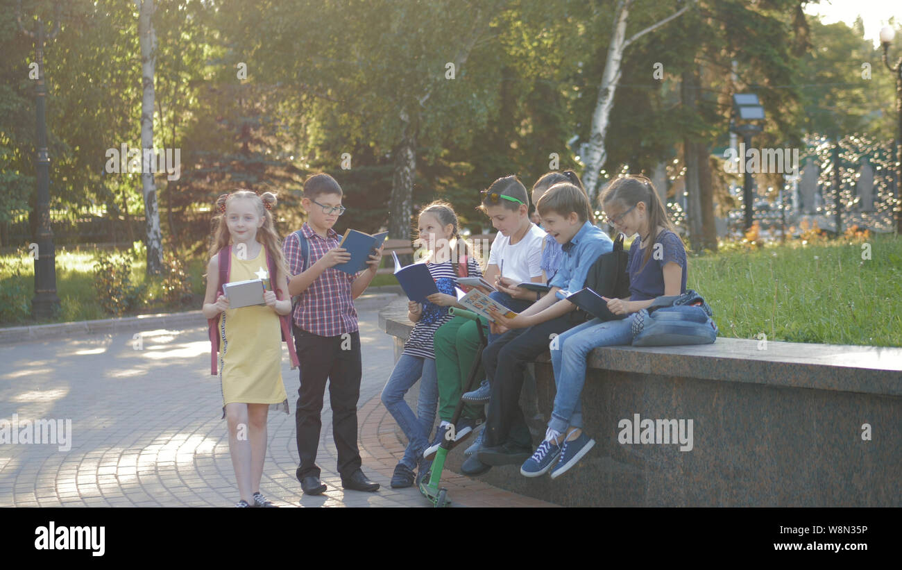 Cute kids study with books and notebooks Stock Photo - Alamy