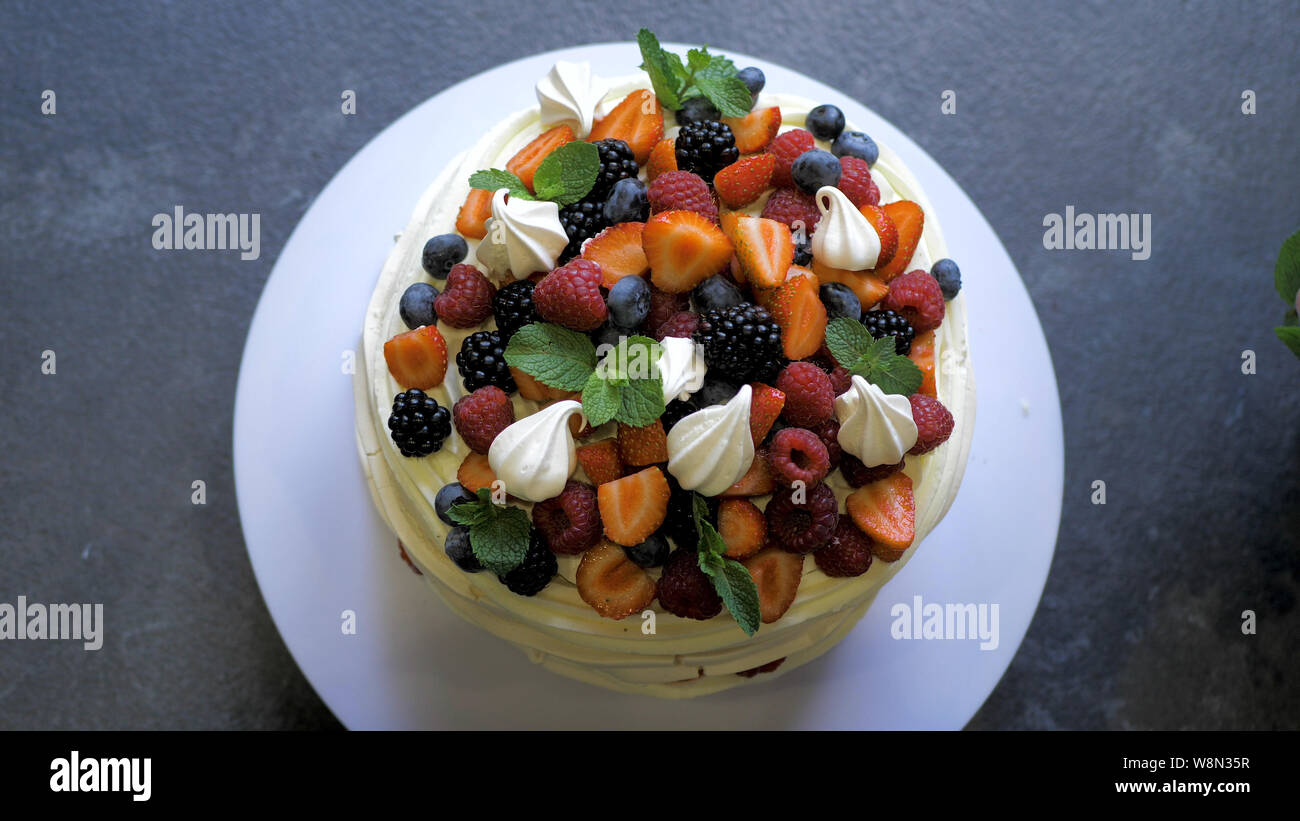 Dessert Anna Pavlova on a black background Stock Photo - Alamy