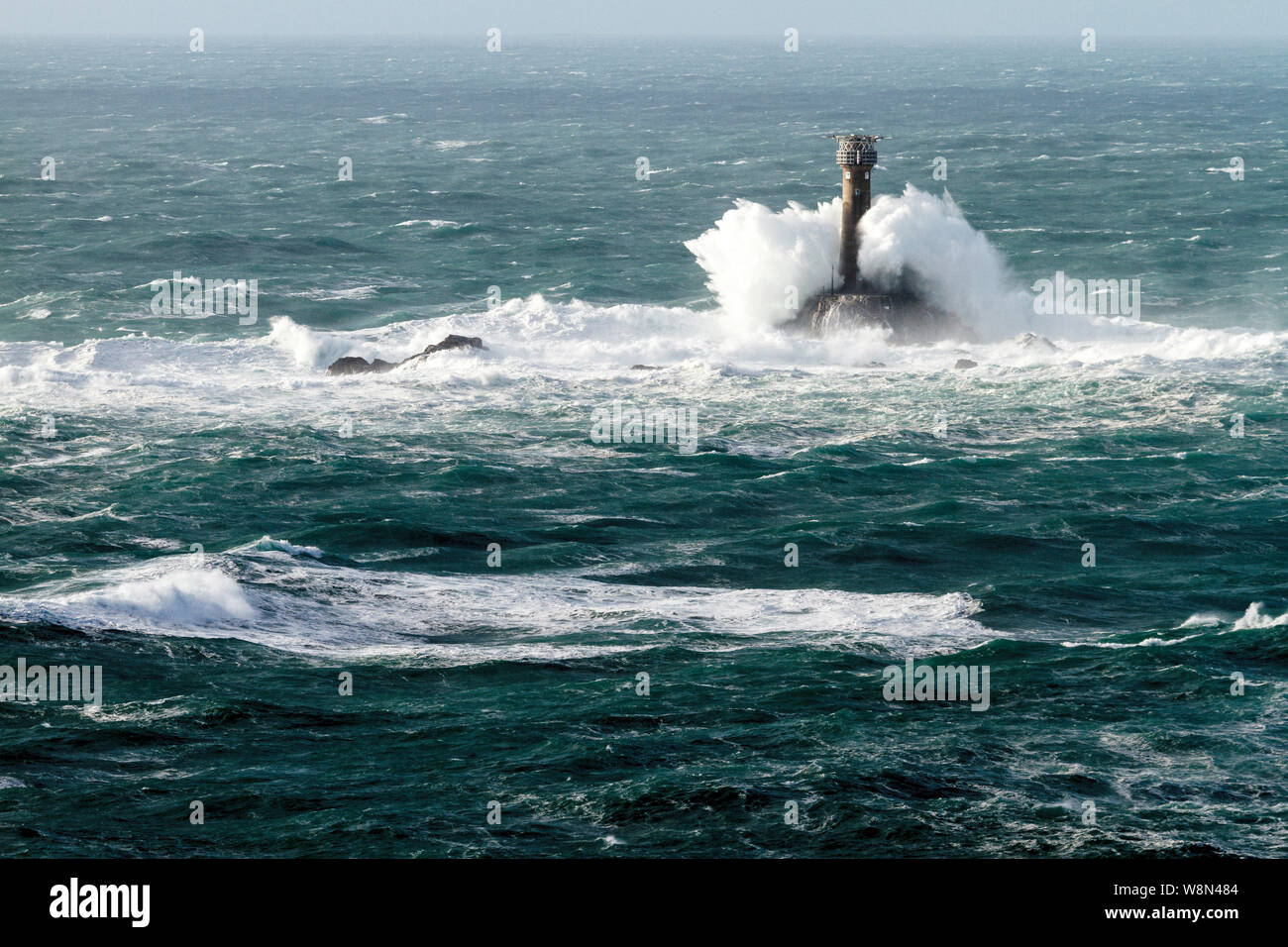 Storm waves hit and break over Longships Lighthouse, Lands End ...