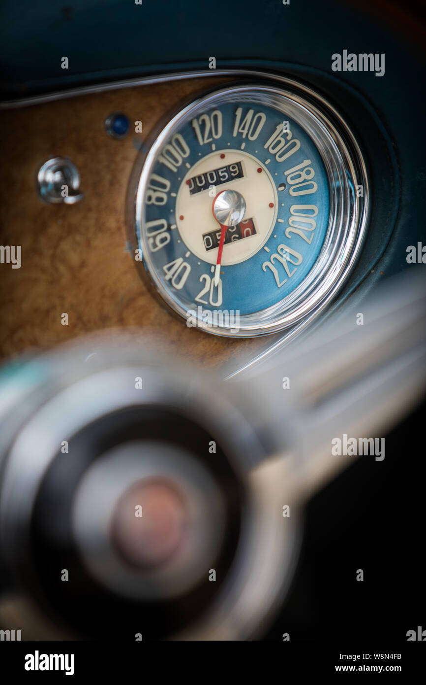 Color close up shot of a blue speedometer on a vintage car's dashboard ...
