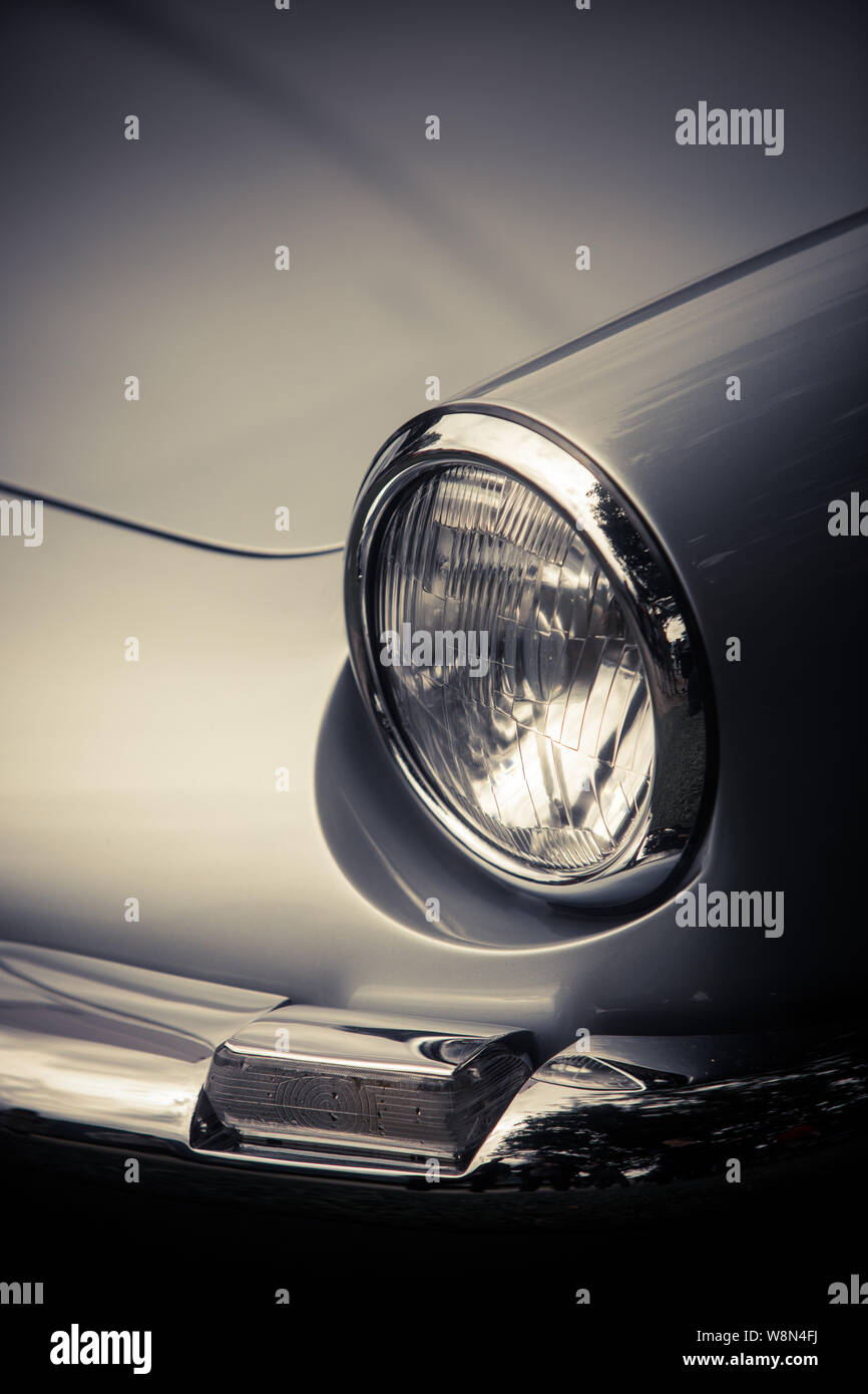 Close up vertical image of the headlight of a vintage classic car Stock ...