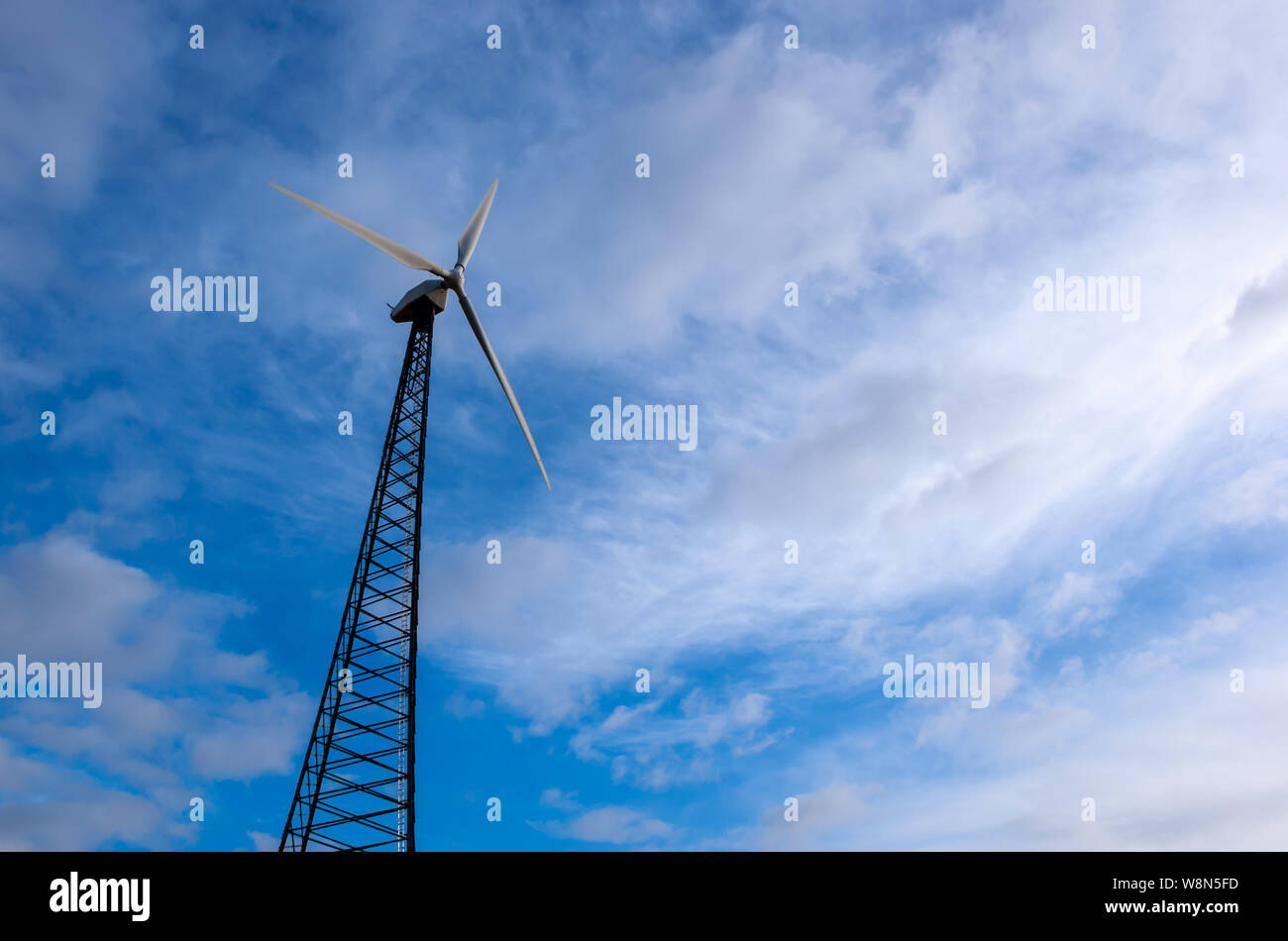 Wind Power Station - Wind Turbine Against The Blue Sky Stock Photo - Alamy