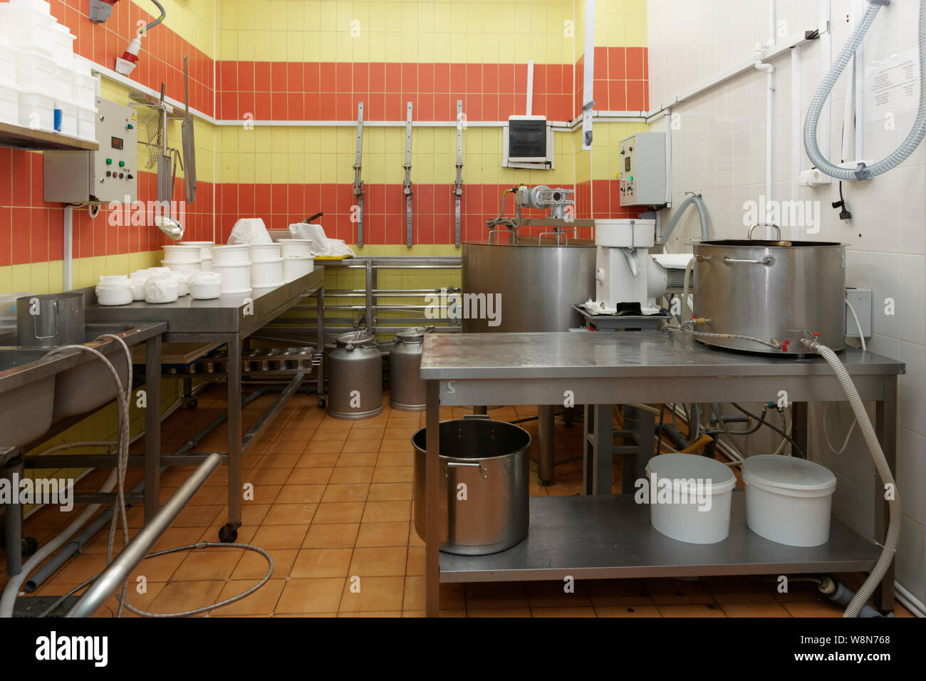 Cheese making room on food processing plant Stock Photo - Alamy