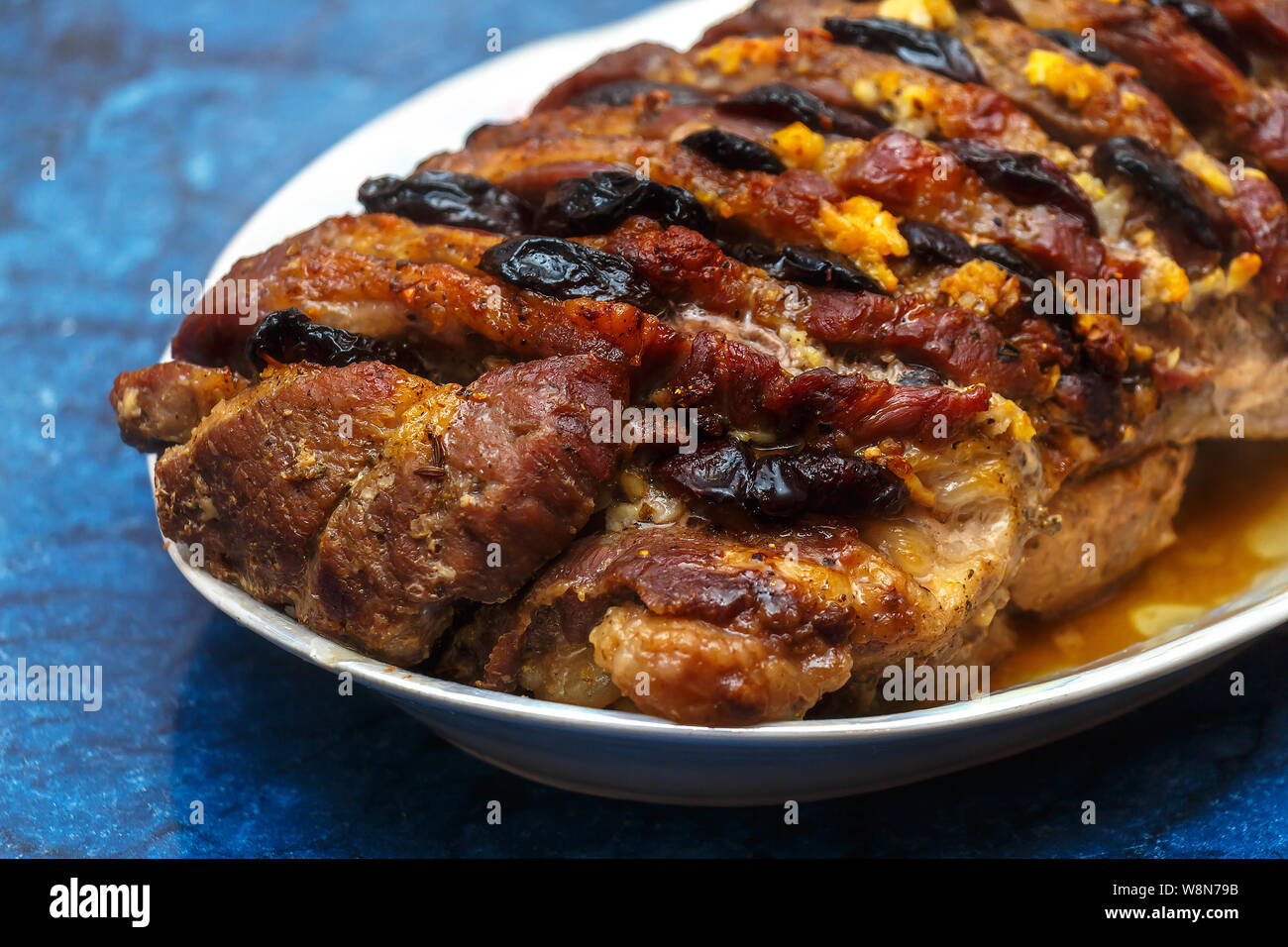 baked meat with prunes Stock Photo - Alamy