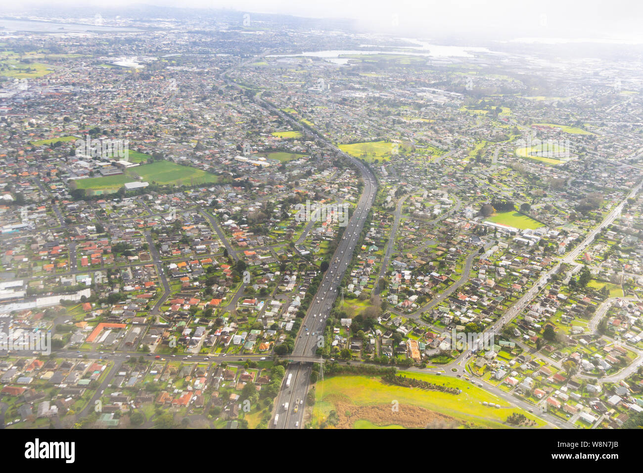 Auckland city aerial, suburban and industrial areas below Stock Photo ...