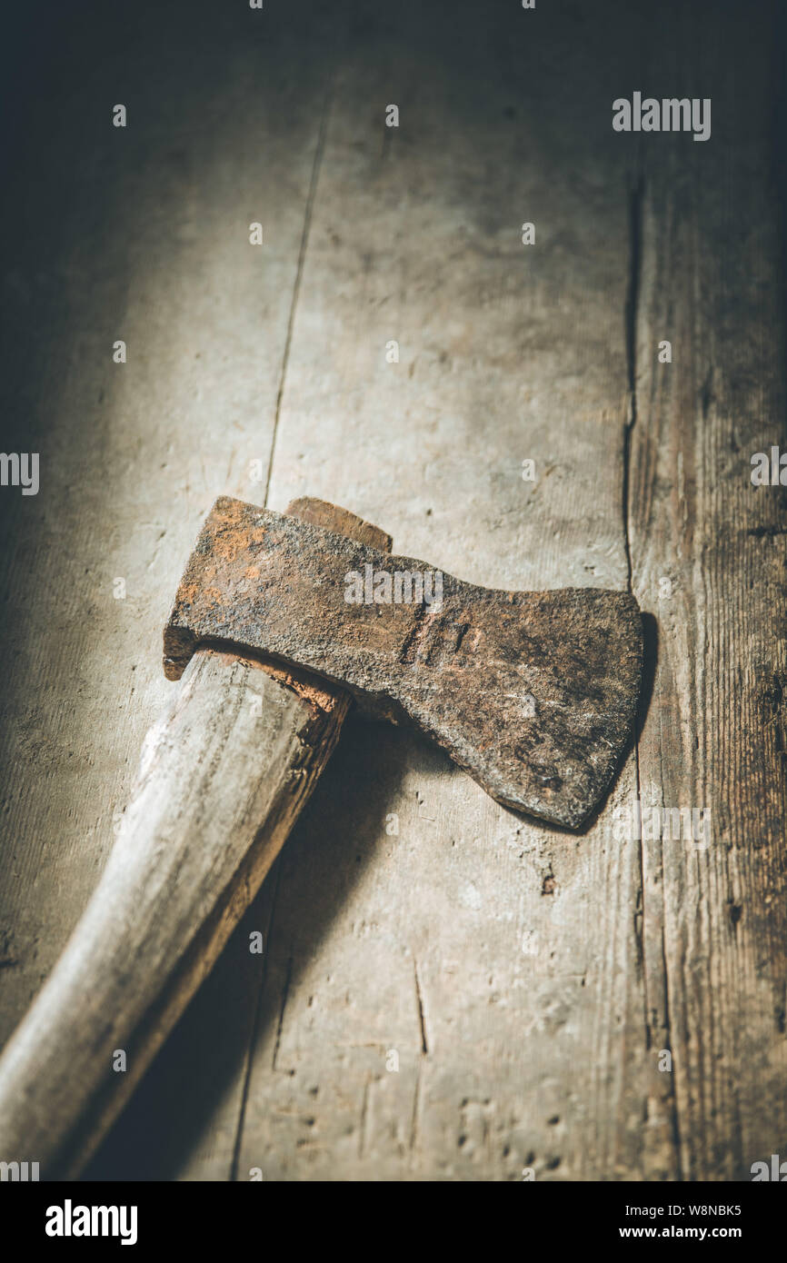 Old historic axe on wooden background, warrior weapon Stock Photo - Alamy