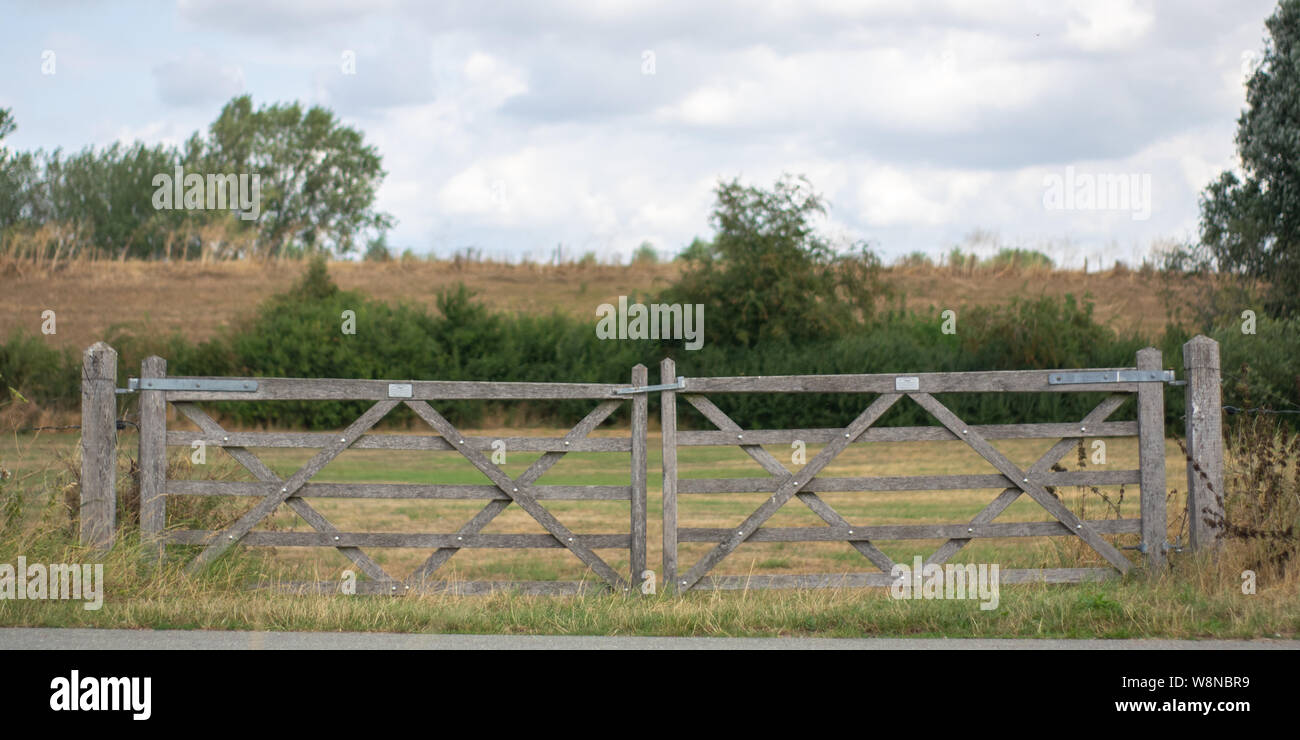 wooden gate for a Dutch pasture and a dike that stops the water in the ...
