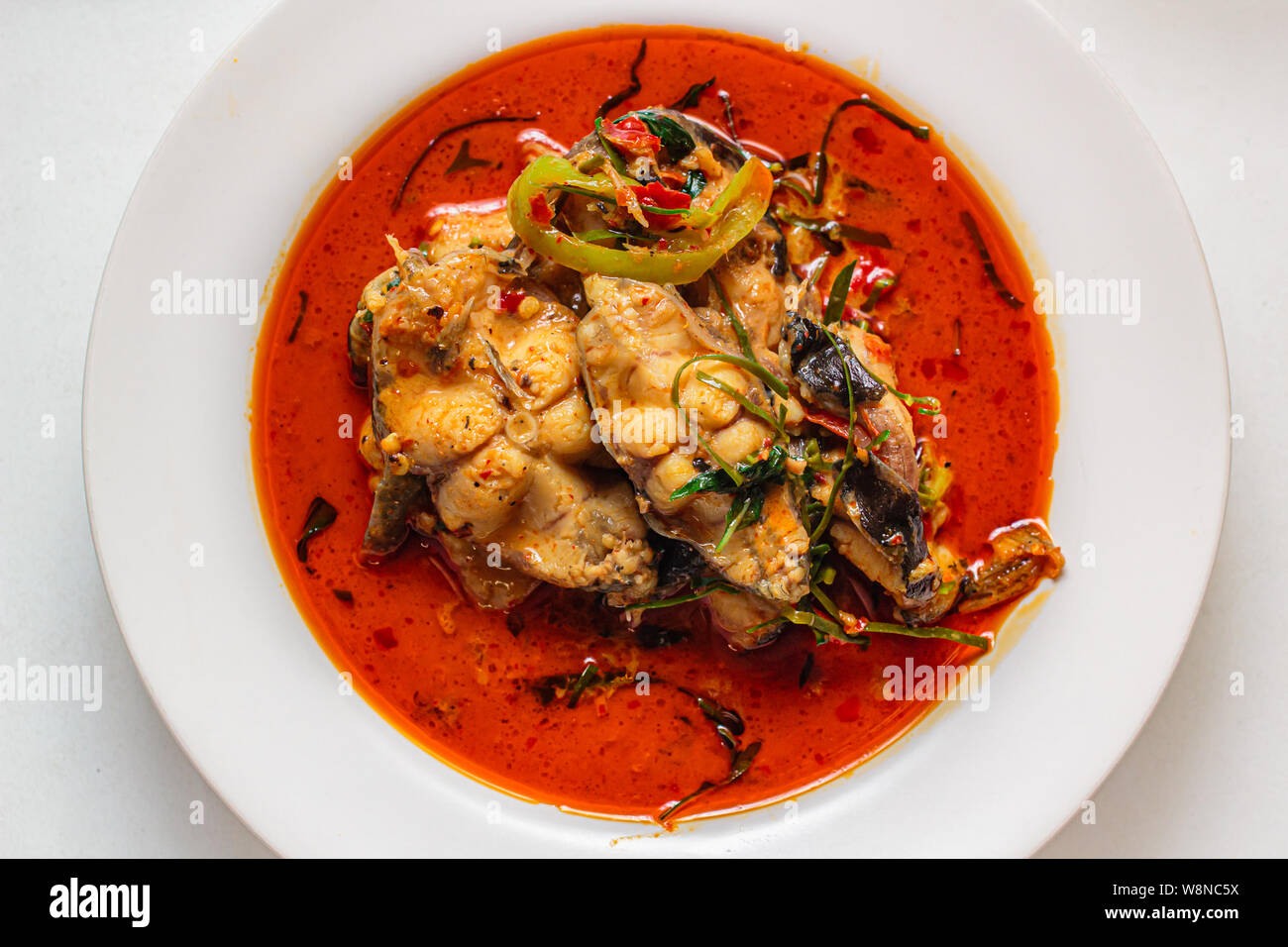 Catfish with spicy red curry paste, thai food Stock Photo - Alamy