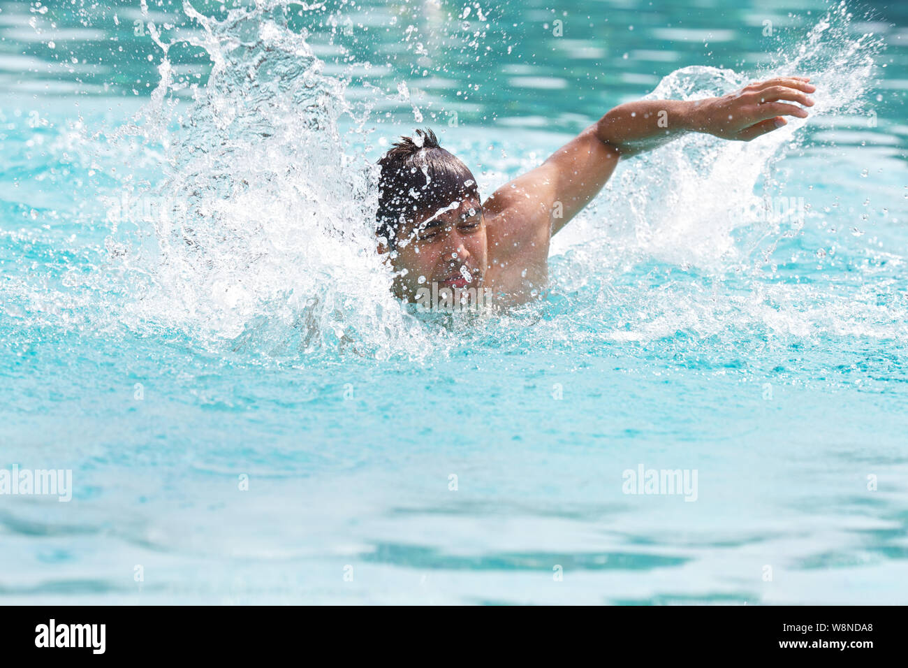 Young man in a swimming pool Stock Photo - Alamy