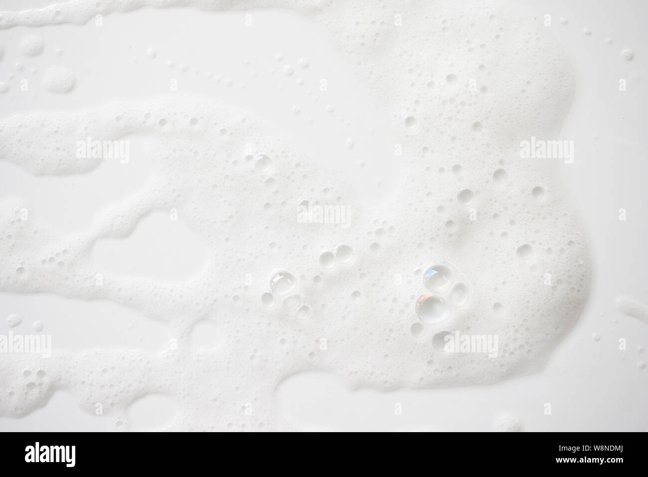 Abstract background white soapy foam texture. Shampoo foam with bubbles ...