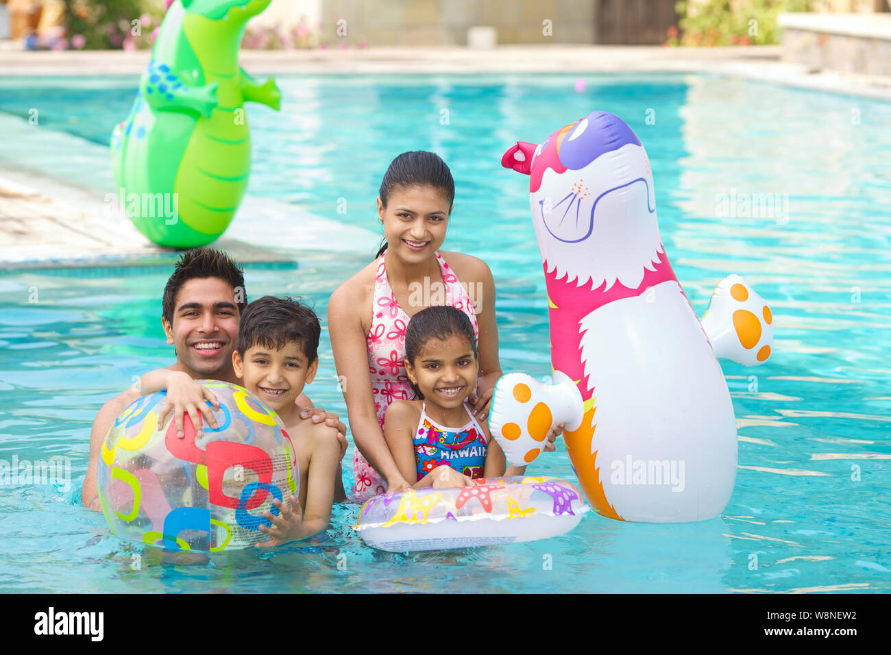 Brother and sister playing in pool hi-res stock photography and images ...