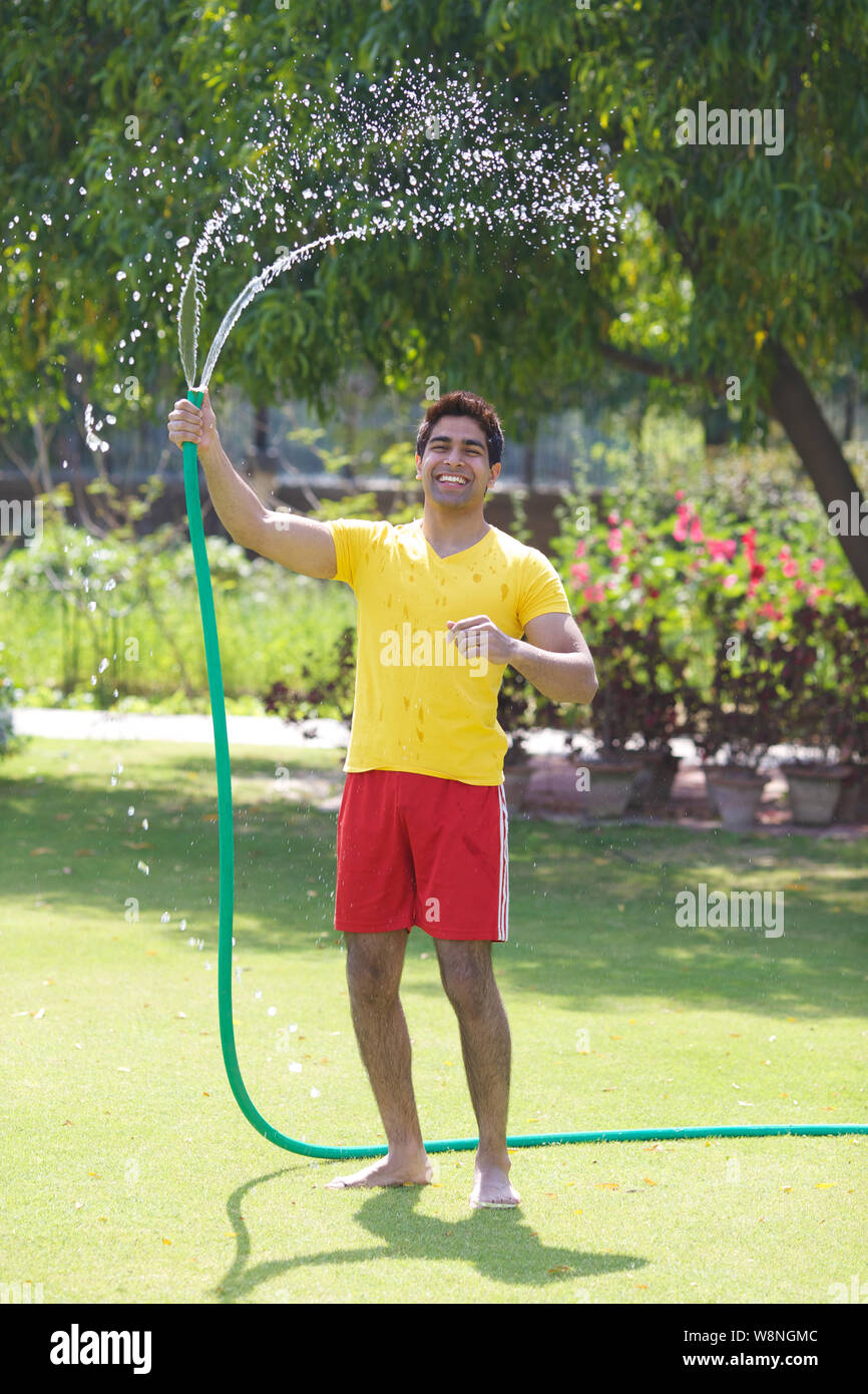 Indian man playing pipe hi-res stock photography and images - Alamy
