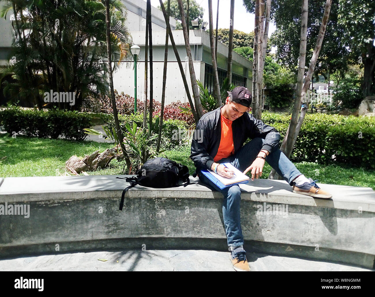 Education concept. Young latino student doing homework at University ...