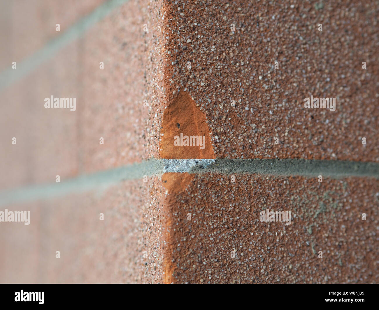 red brick wall damaged by an explosion Stock Photo - Alamy