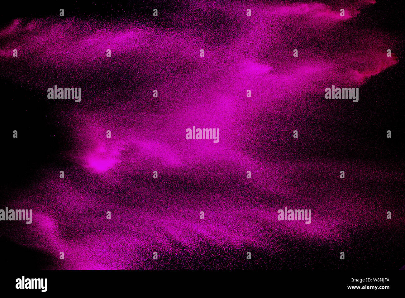 Pink particle dust splash on black background. Pink powder exploding ...