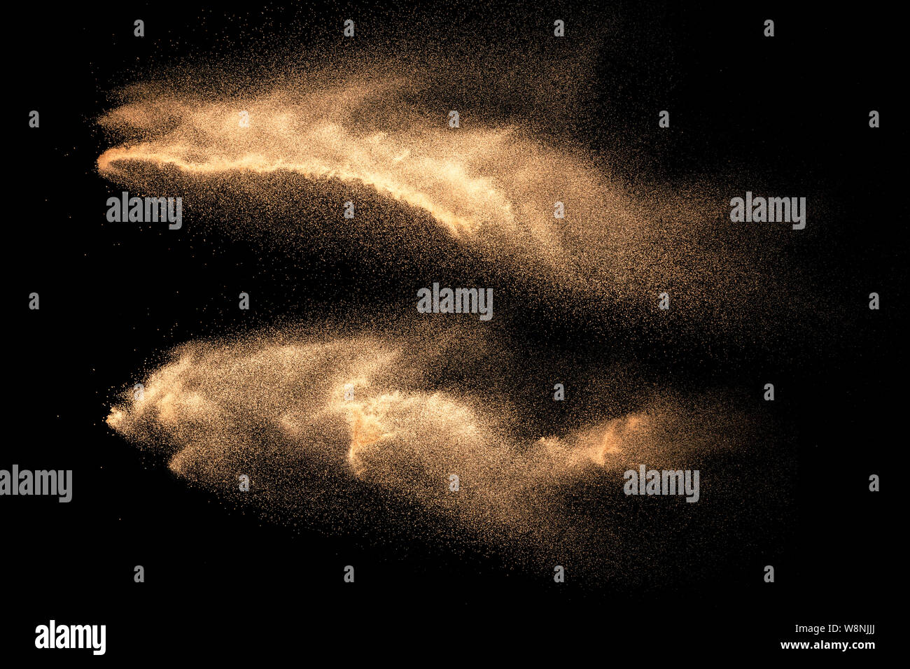 Brown colored sand splash against dark background. Dry river sand ...