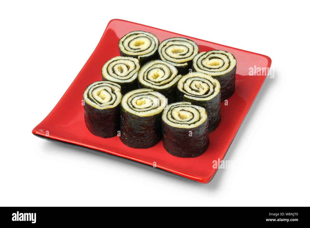 Dish with traditional Japanese egg rolls with nori isolated on white ...
