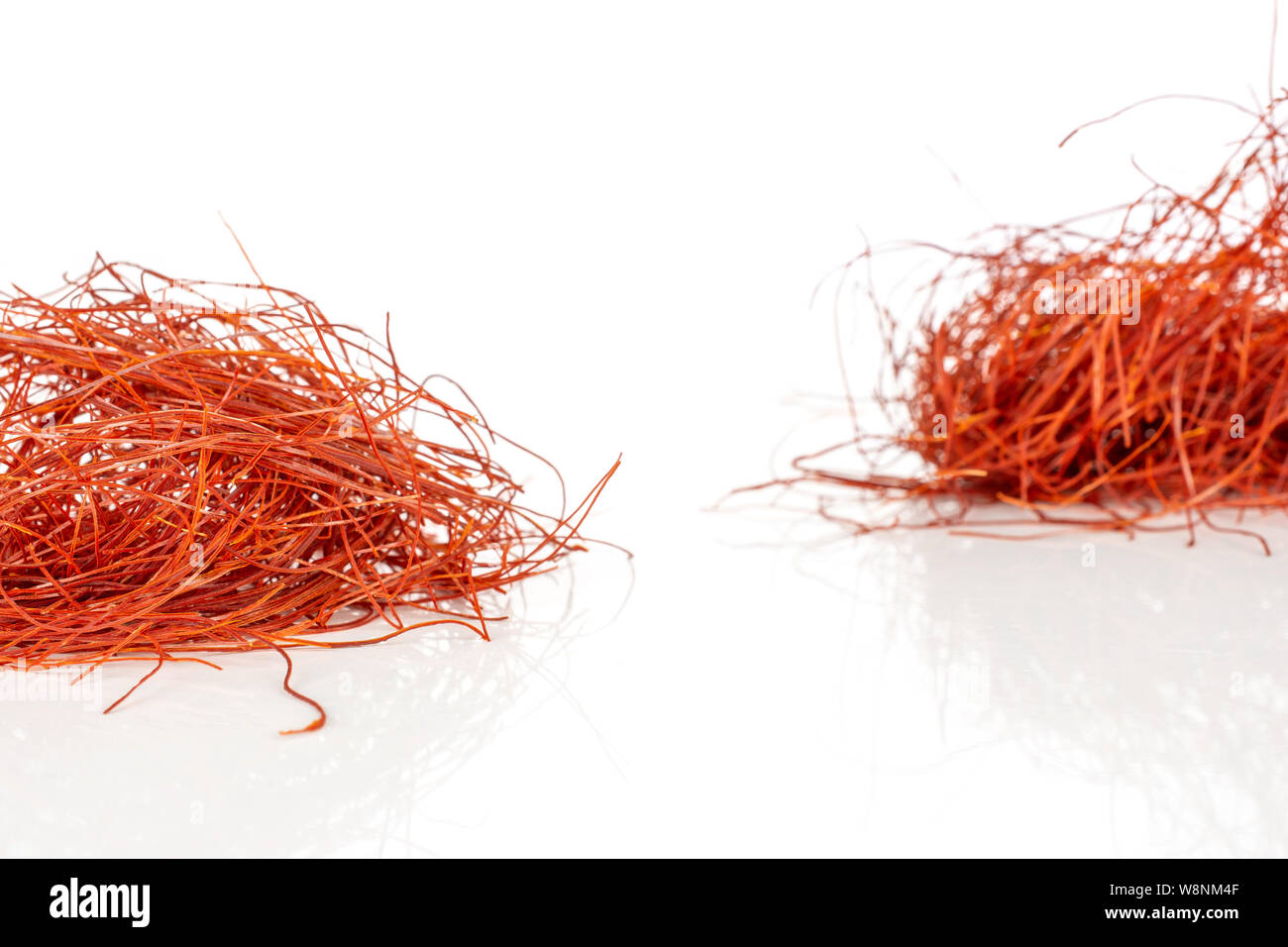 Lot of whole red chili pepper threads two stacks isolated on white ...