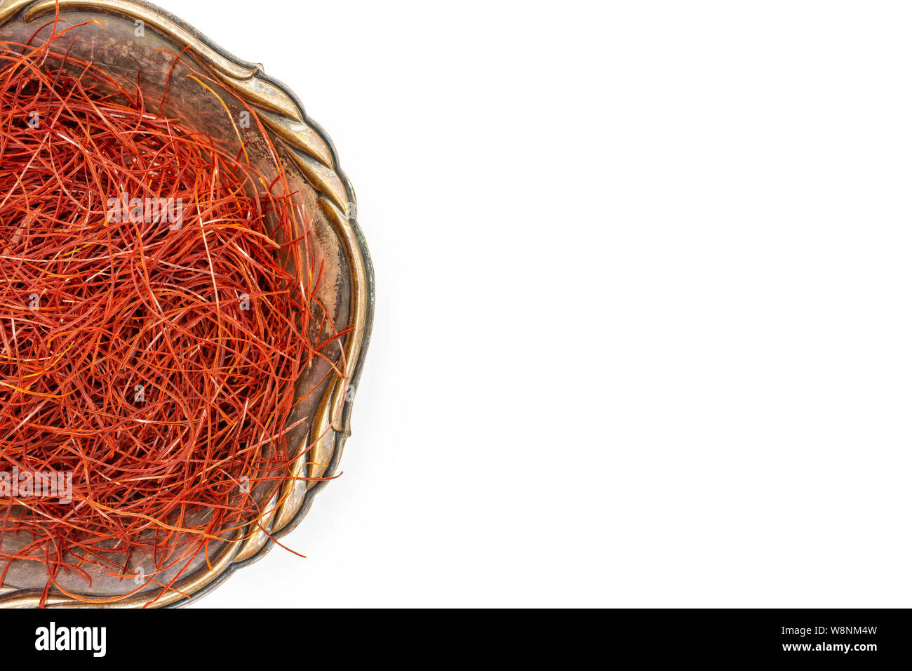 Lot of whole red chili pepper threads copyspace on right in old iron ...