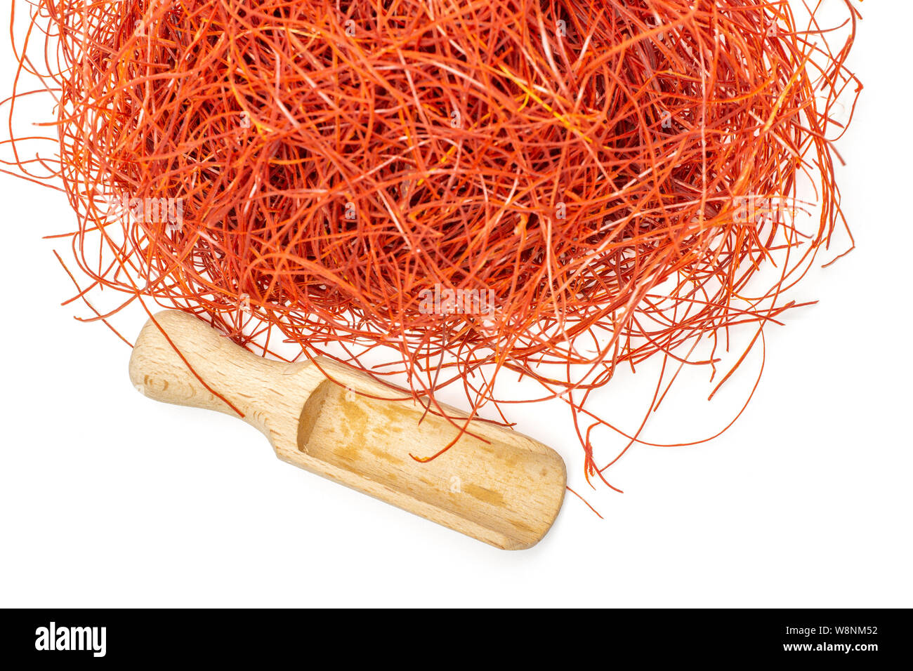 Lot of whole red chili pepper threads with wooden scoop flatlay ...