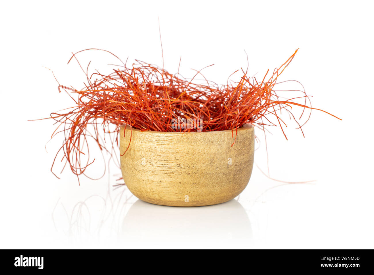Lot of whole red chili pepper threads in wooden bowl isolated on white ...