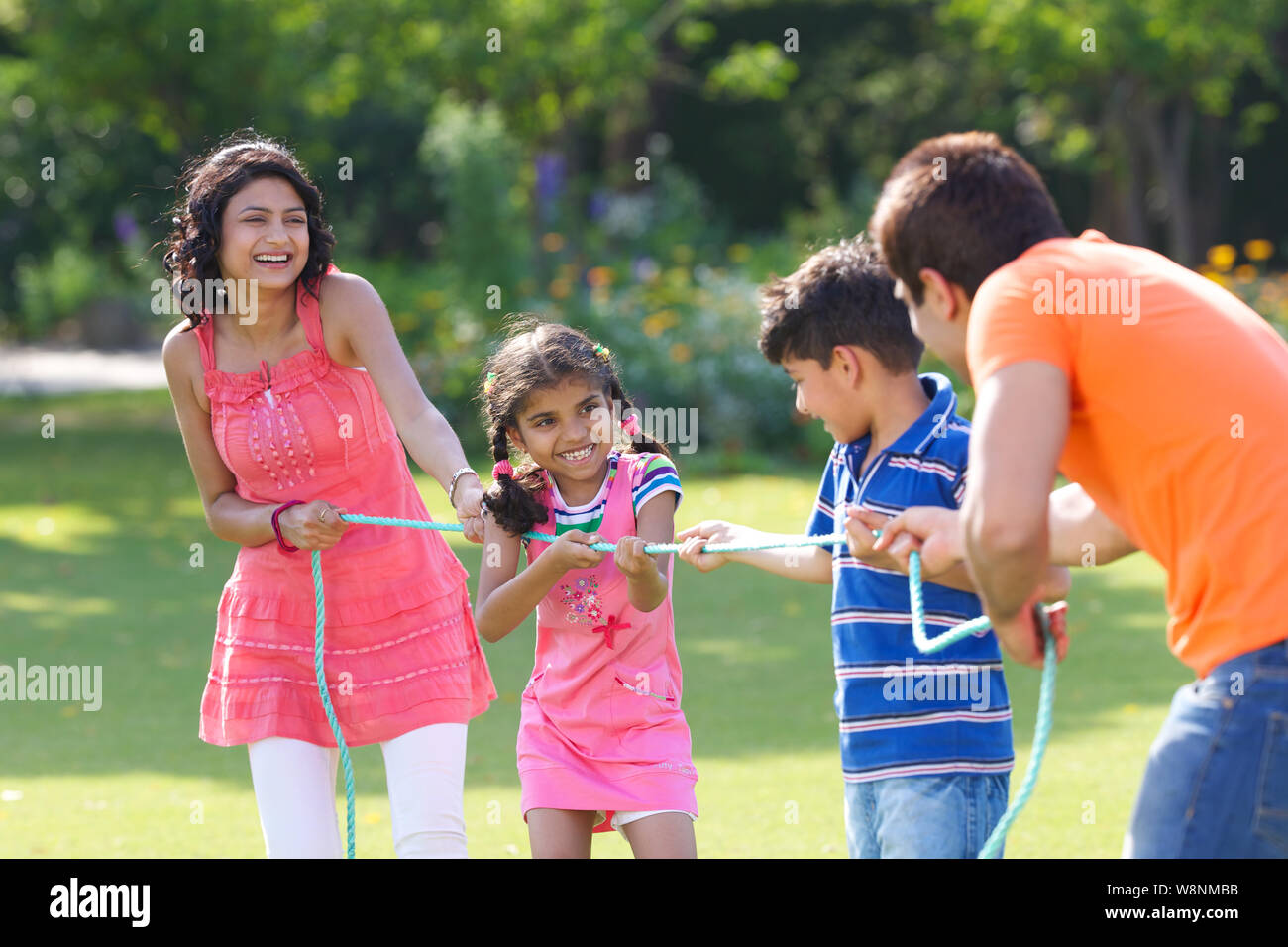 Girls playing tug war hi-res stock photography and images - Alamy