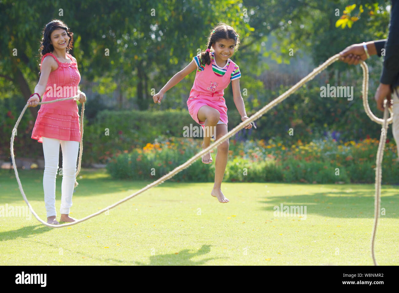 Mother daughter jumping rope hi-res stock photography and images - Alamy