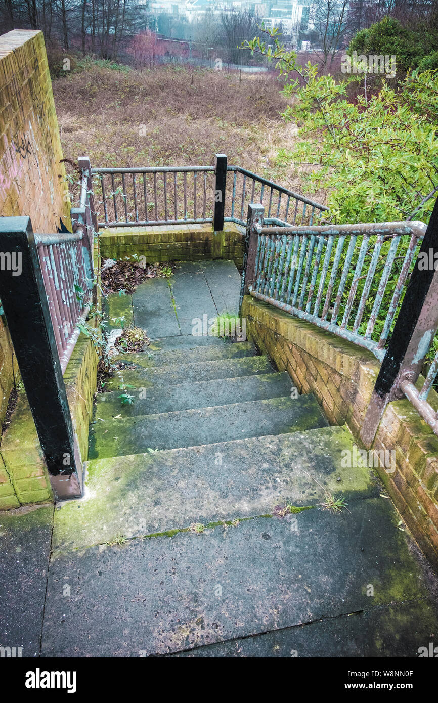 Steps leading down from a pedestrian footbridge in Consett, County ...