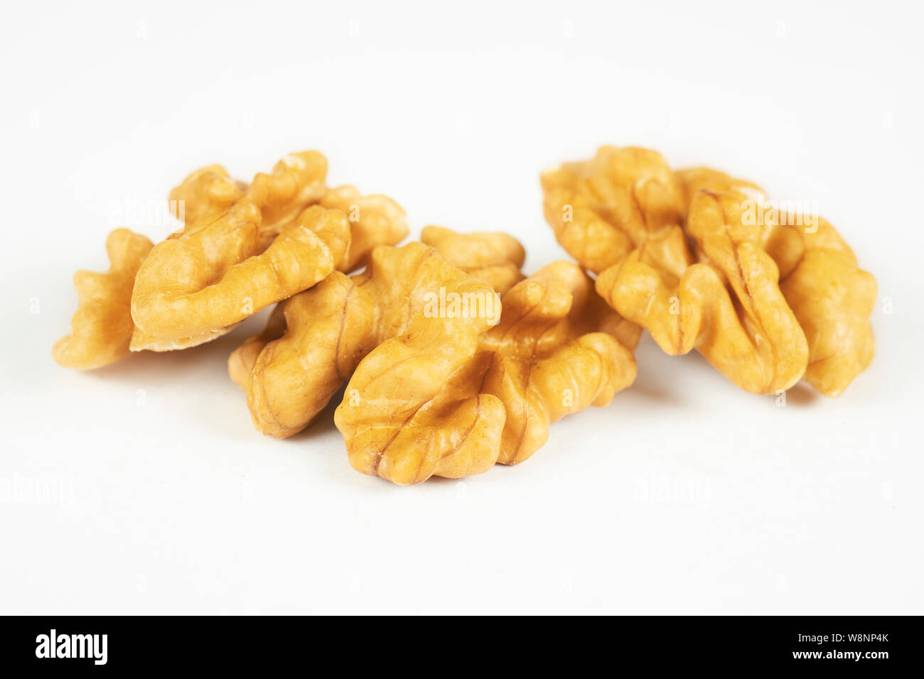 Walnuts isolated on white background. Pile of walnuts without shell ...