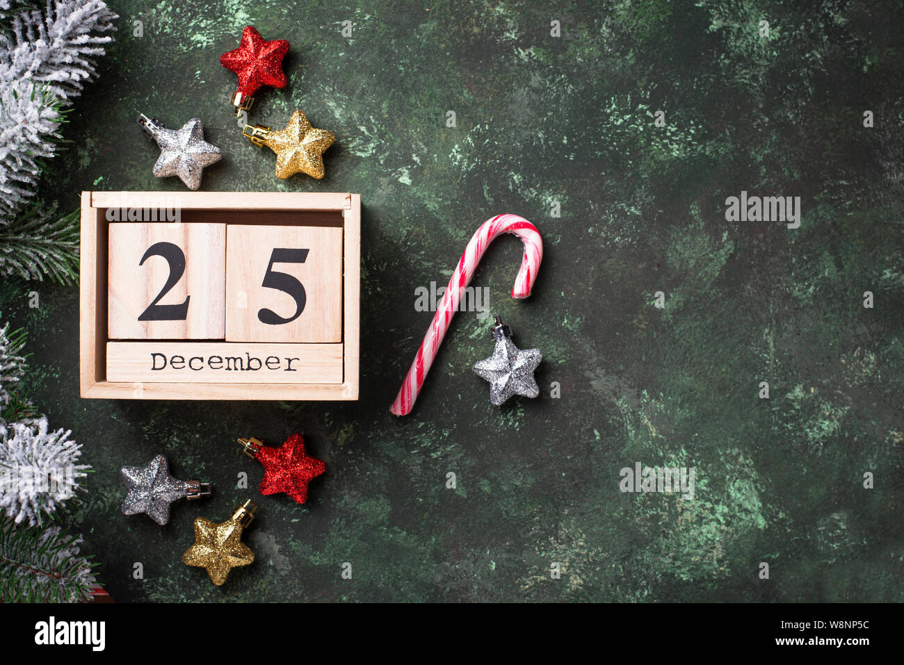 Christmas background with wooden calendar and shiny star Stock Photo ...