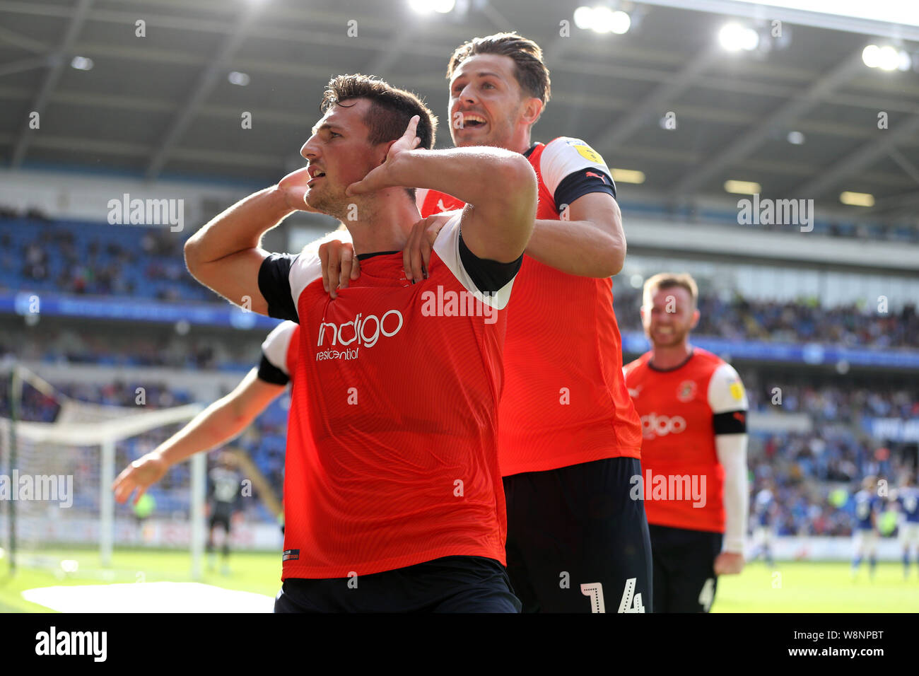 Cardiff, UK. 10th Aug, 2019. Matty Pearson of Luton Town (l) celebrates ...
