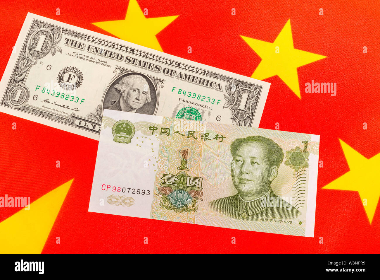 Close-up shot U.S. 1 Dollar bill banknote & Chinese 1 Yuan Renminbi ...