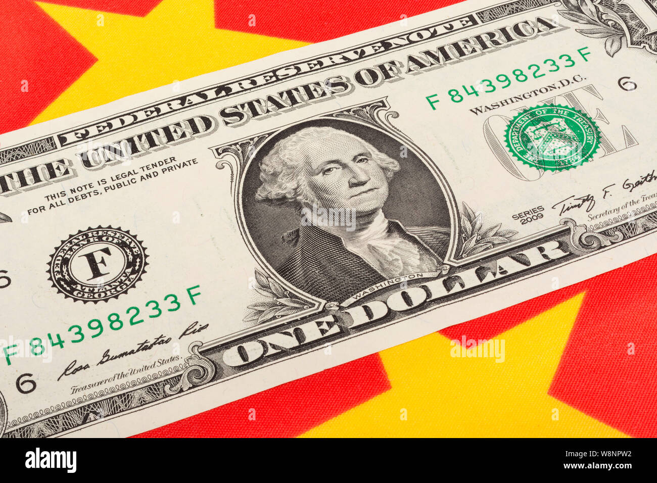 Close-up shot U.S. 1 Dollar bill banknote, and red Chinese flag ...
