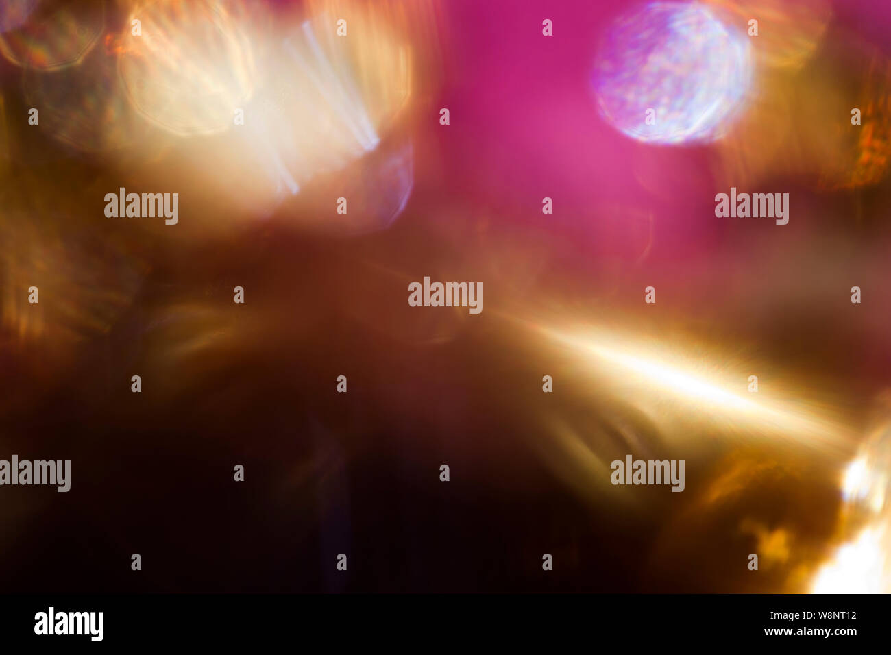Smooth multicolor spots of bright light shining on blurred background ...