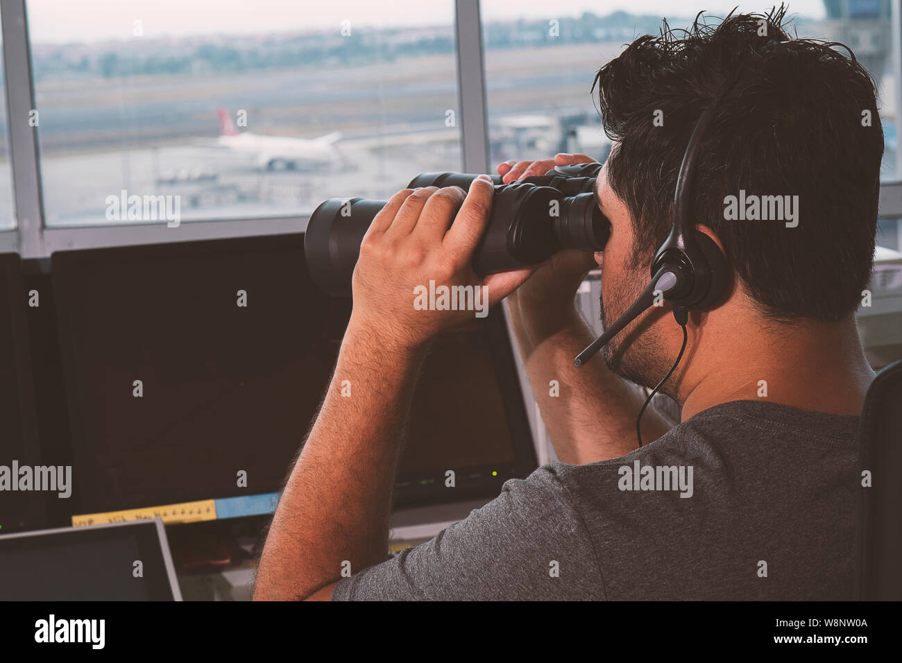 flight controller working in the flight control tower Stock Photo - Alamy