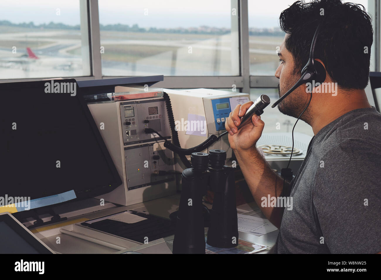 flight controller working in the flight control tower Stock Photo - Alamy