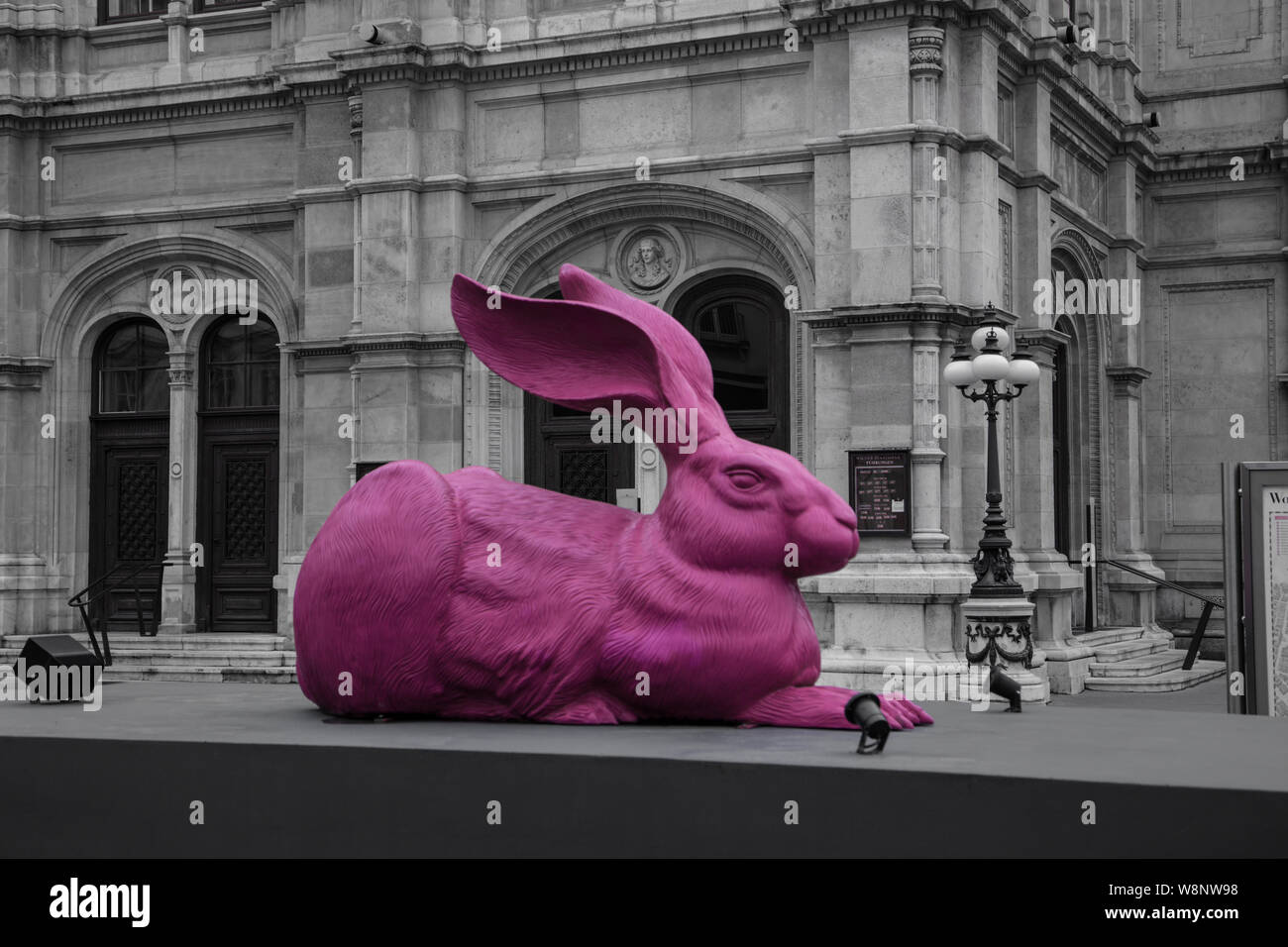 Oster rabbit statue in Vienna Fuchsia color on black and white ...