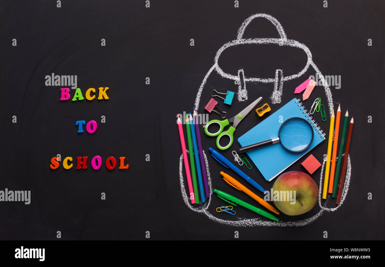 Teenage chalk backpack with office stationery and lunch Stock Photo - Alamy