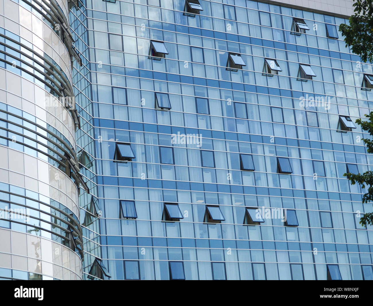 Modern building glass windows with sky reflection Stock Photo - Alamy