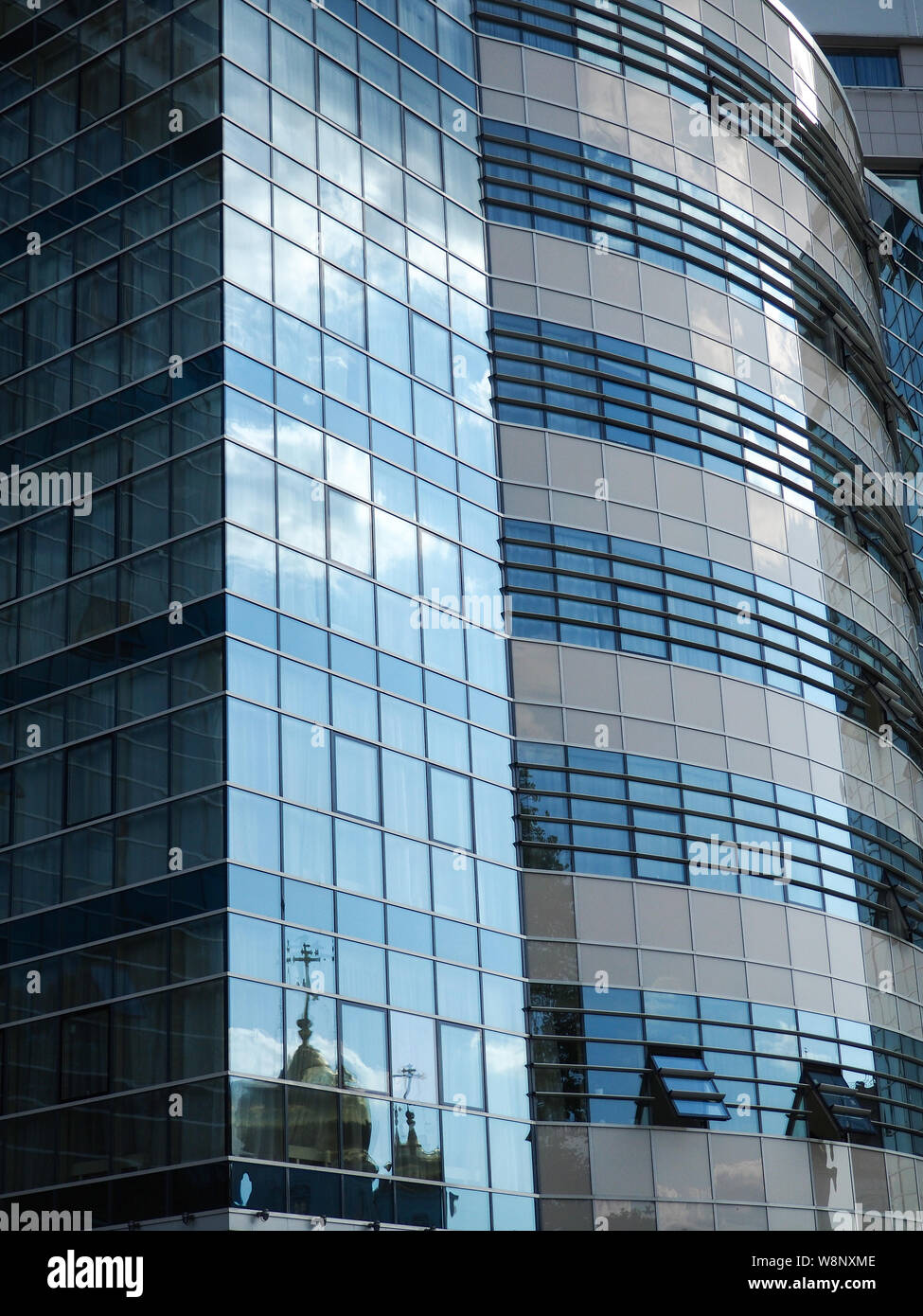 Modern building glass windows with sky reflection Stock Photo - Alamy