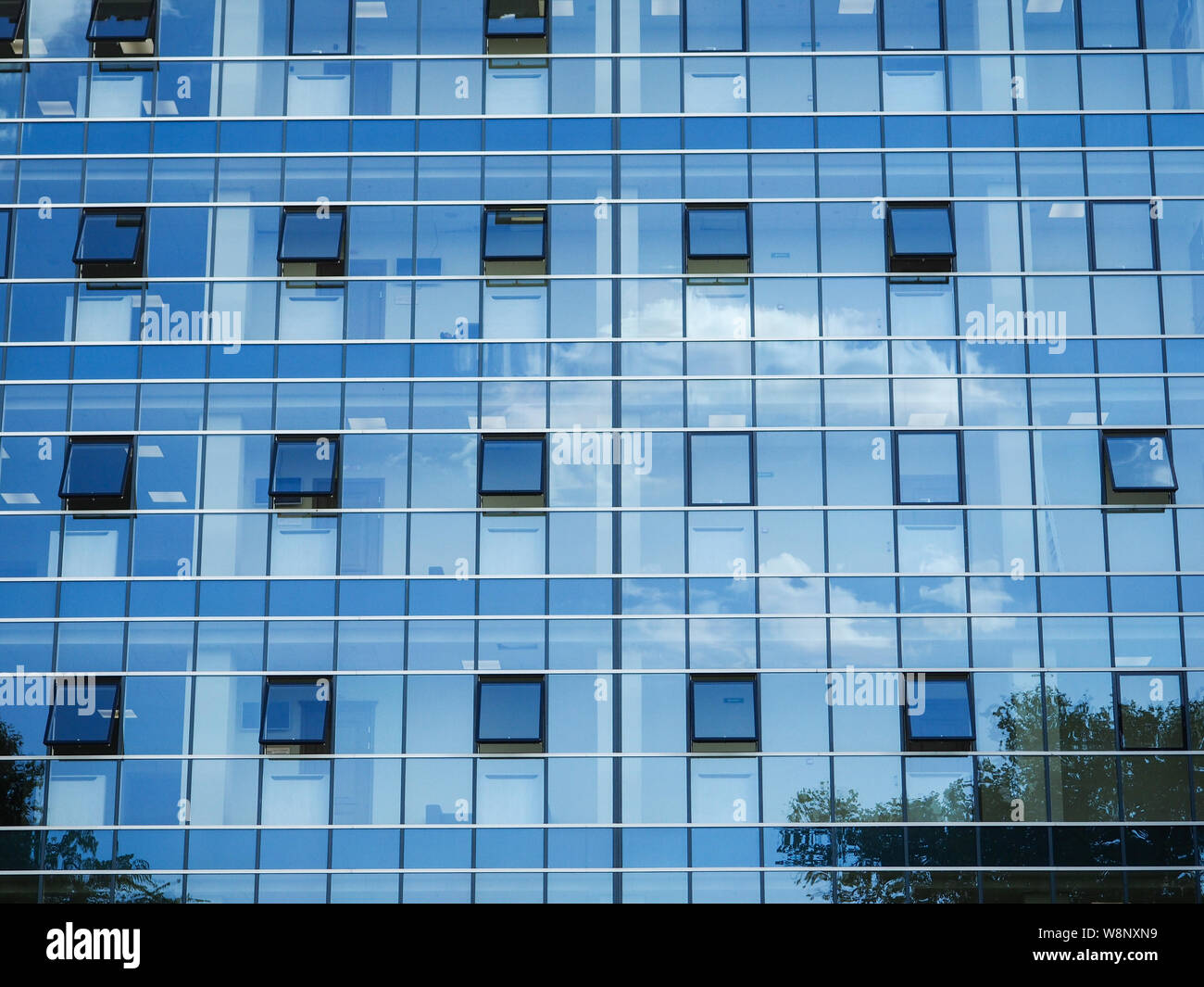 Modern building glass windows with sky reflection Stock Photo - Alamy