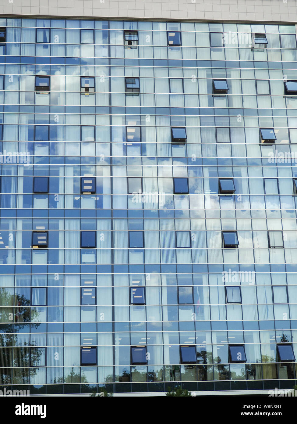Modern building glass windows with sky reflection Stock Photo - Alamy