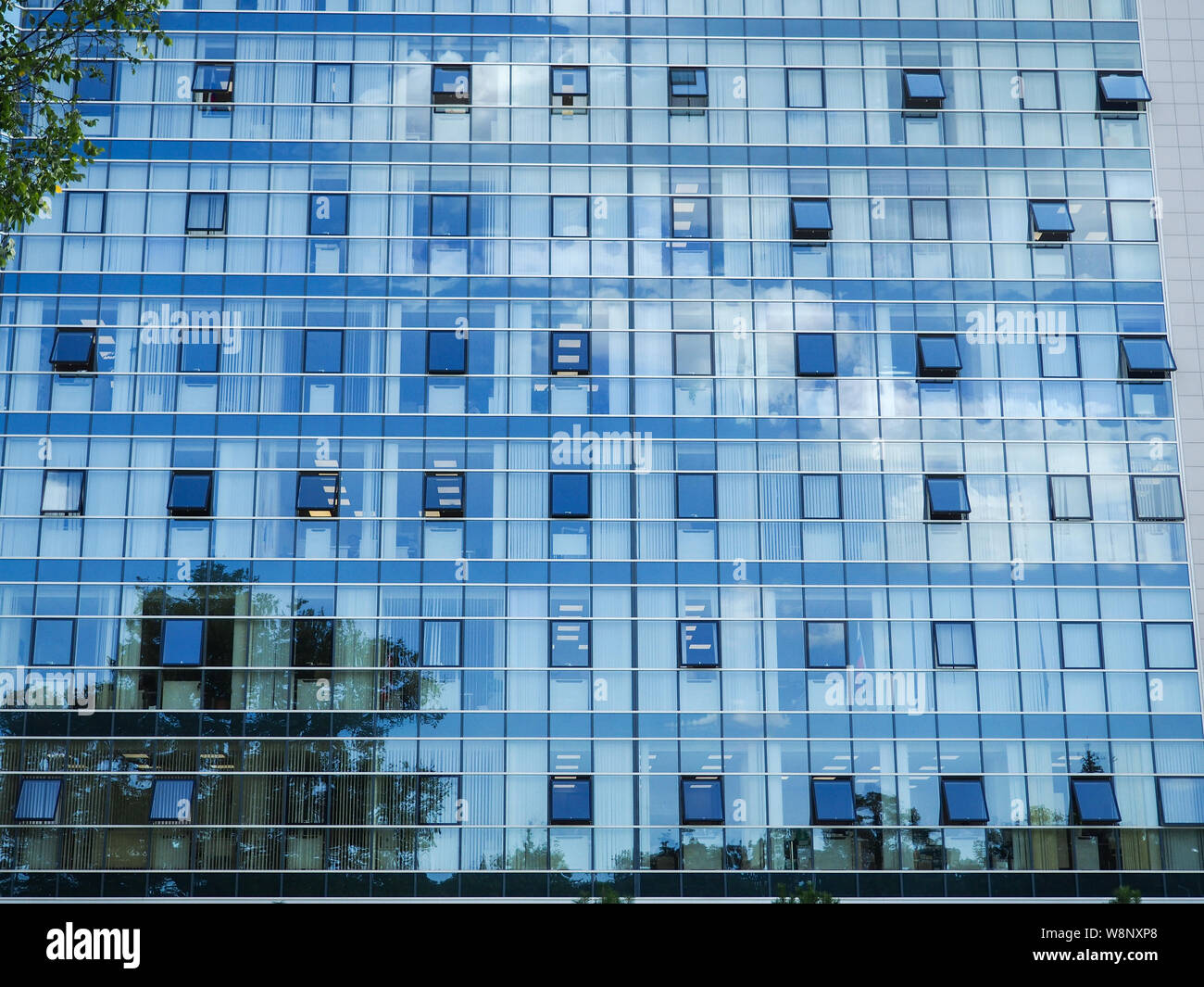 Modern building glass windows with sky reflection Stock Photo - Alamy