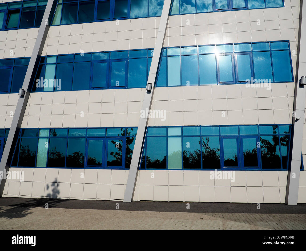 Modern building glass windows with sky reflection Stock Photo - Alamy