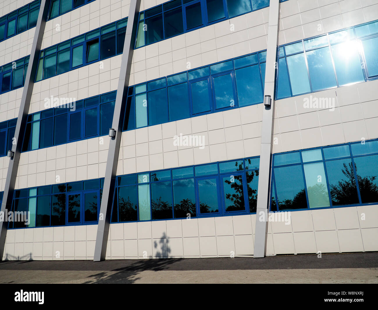Modern building glass windows with sky reflection Stock Photo - Alamy