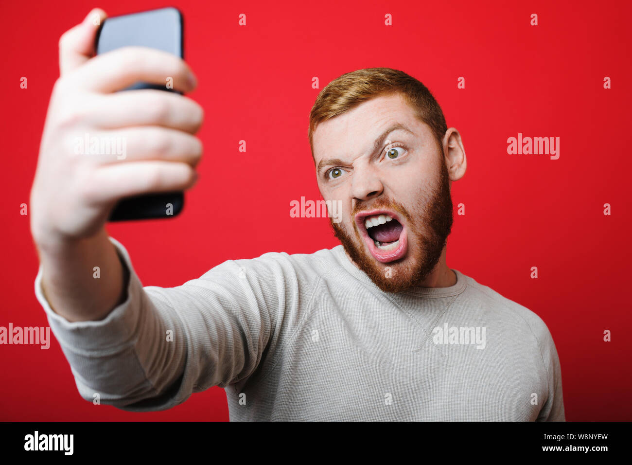 Angry guy making face hi-res stock photography and images - Alamy