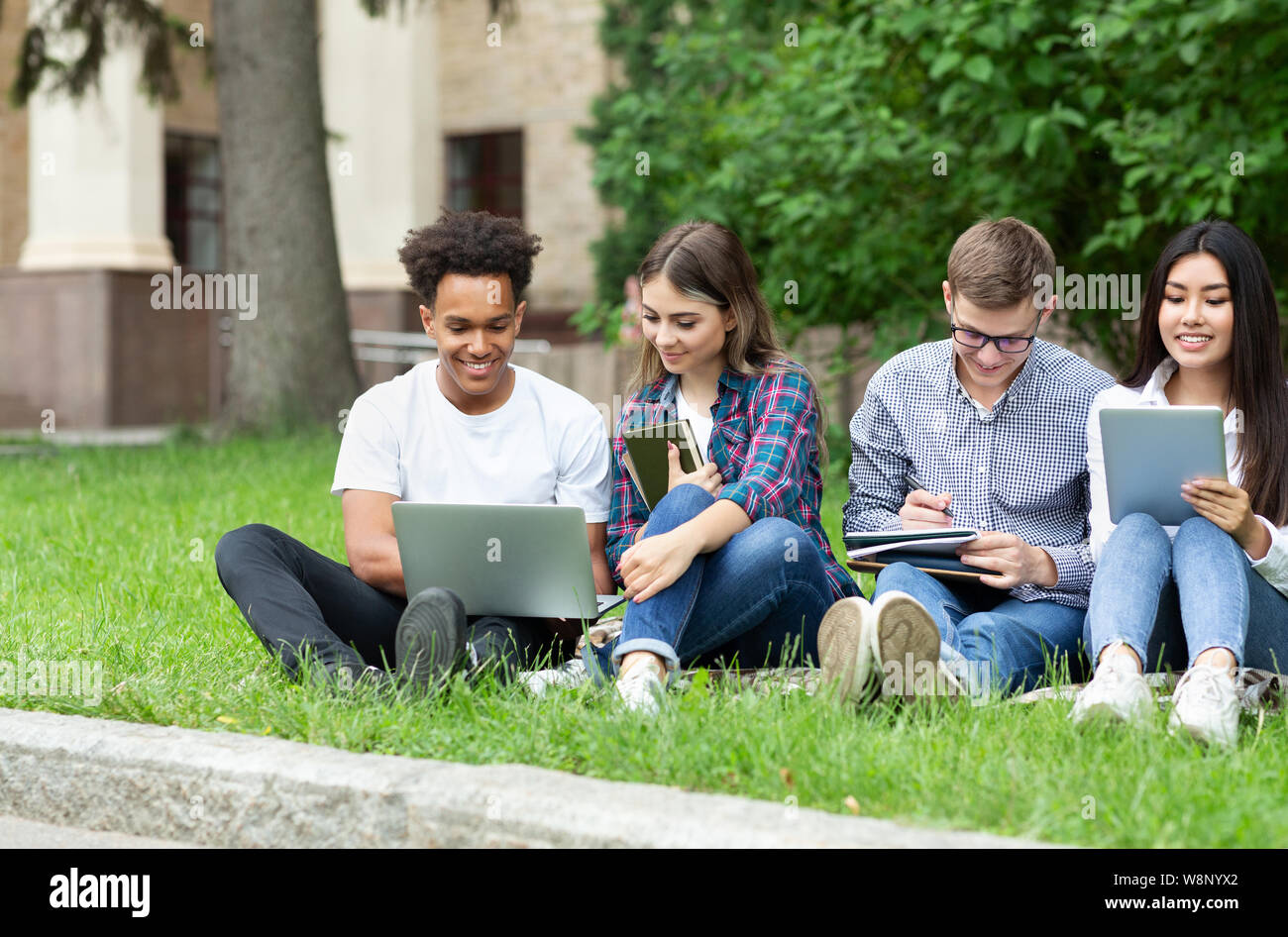 E-learning concept. Diverse students with devices in campus Stock Photo ...