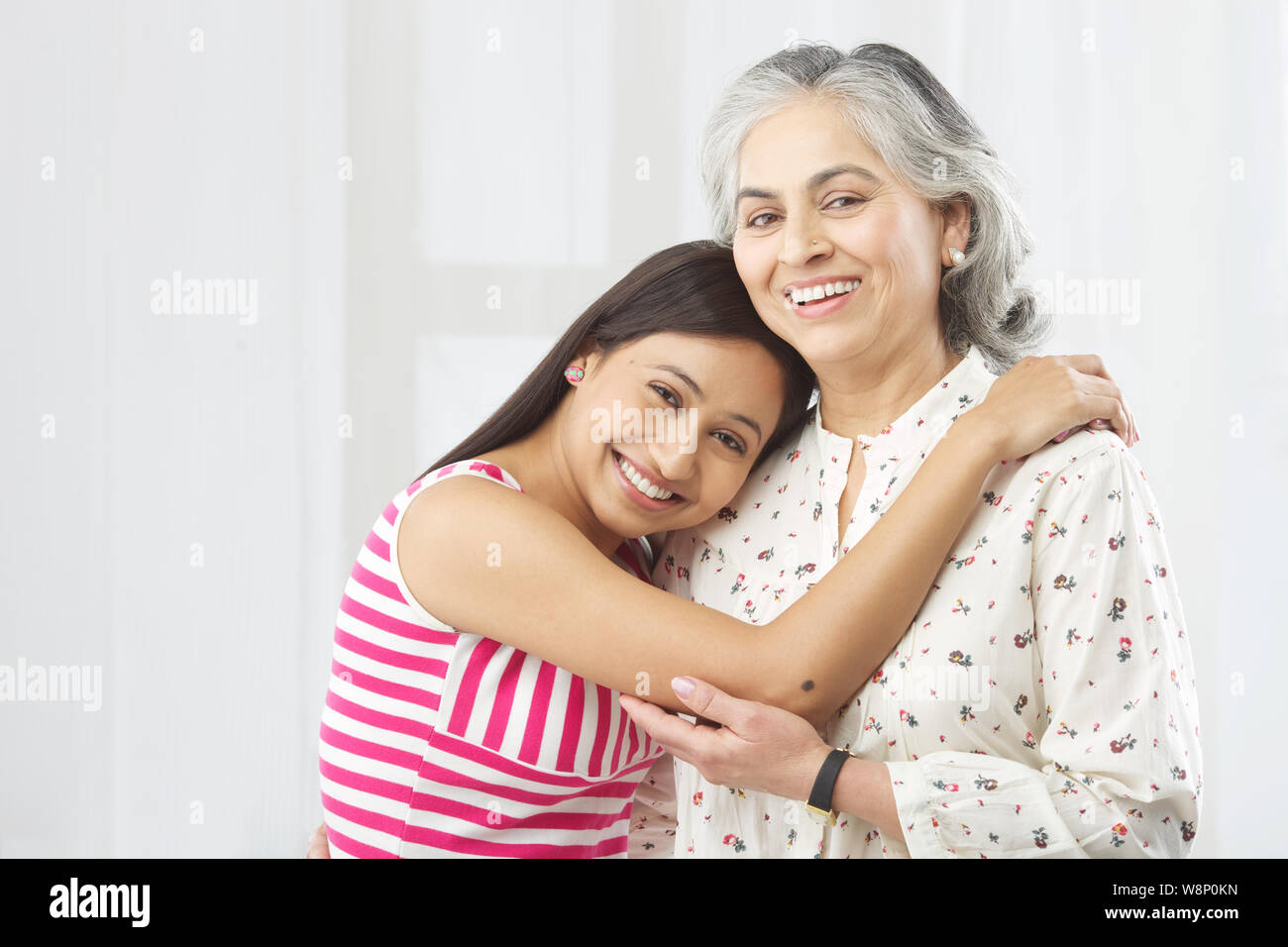 Young woman hugging her mother Stock Photo - Alamy